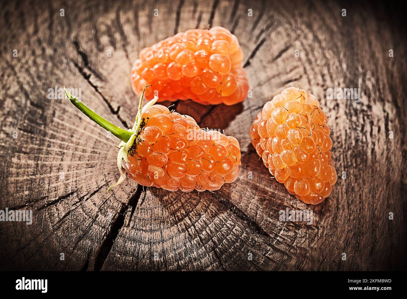 Red blackberries on vintage wooden background Stock Photo - Alamy