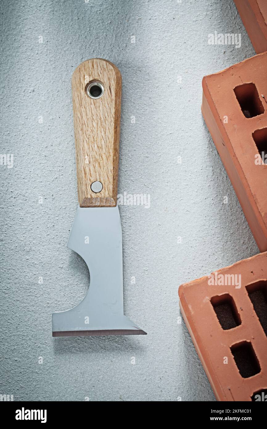 Red bricks bricklaying trowel on concrete background top view building ...