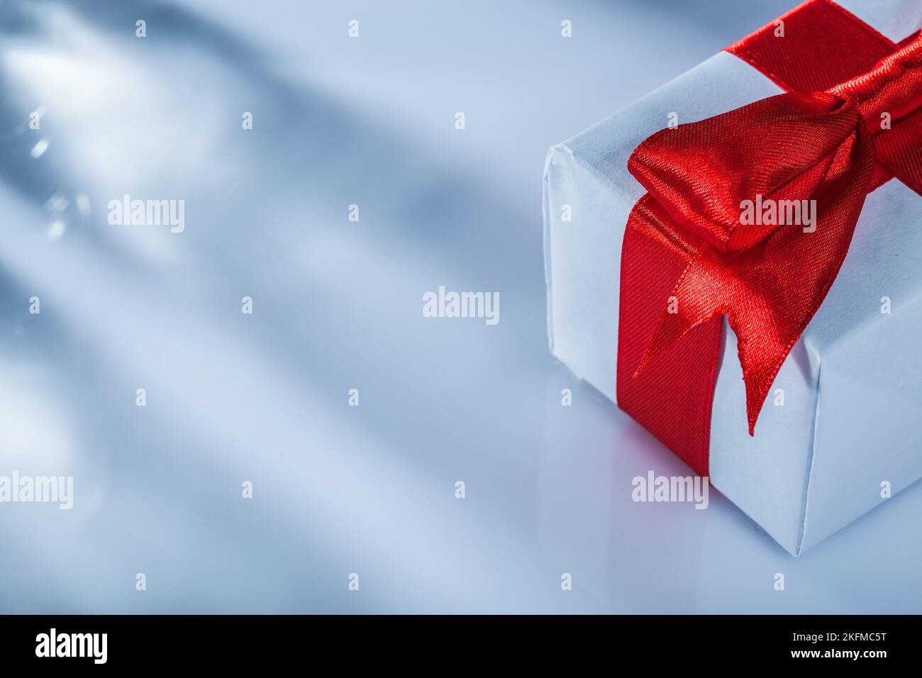 Red present box on white background horizontal image Stock Photo - Alamy