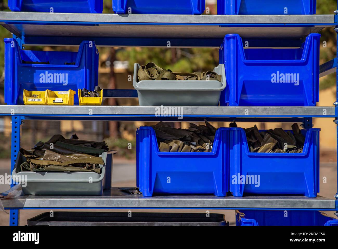 Weapons gear is separated into bins during an M16A4 Service Rifle issue ...