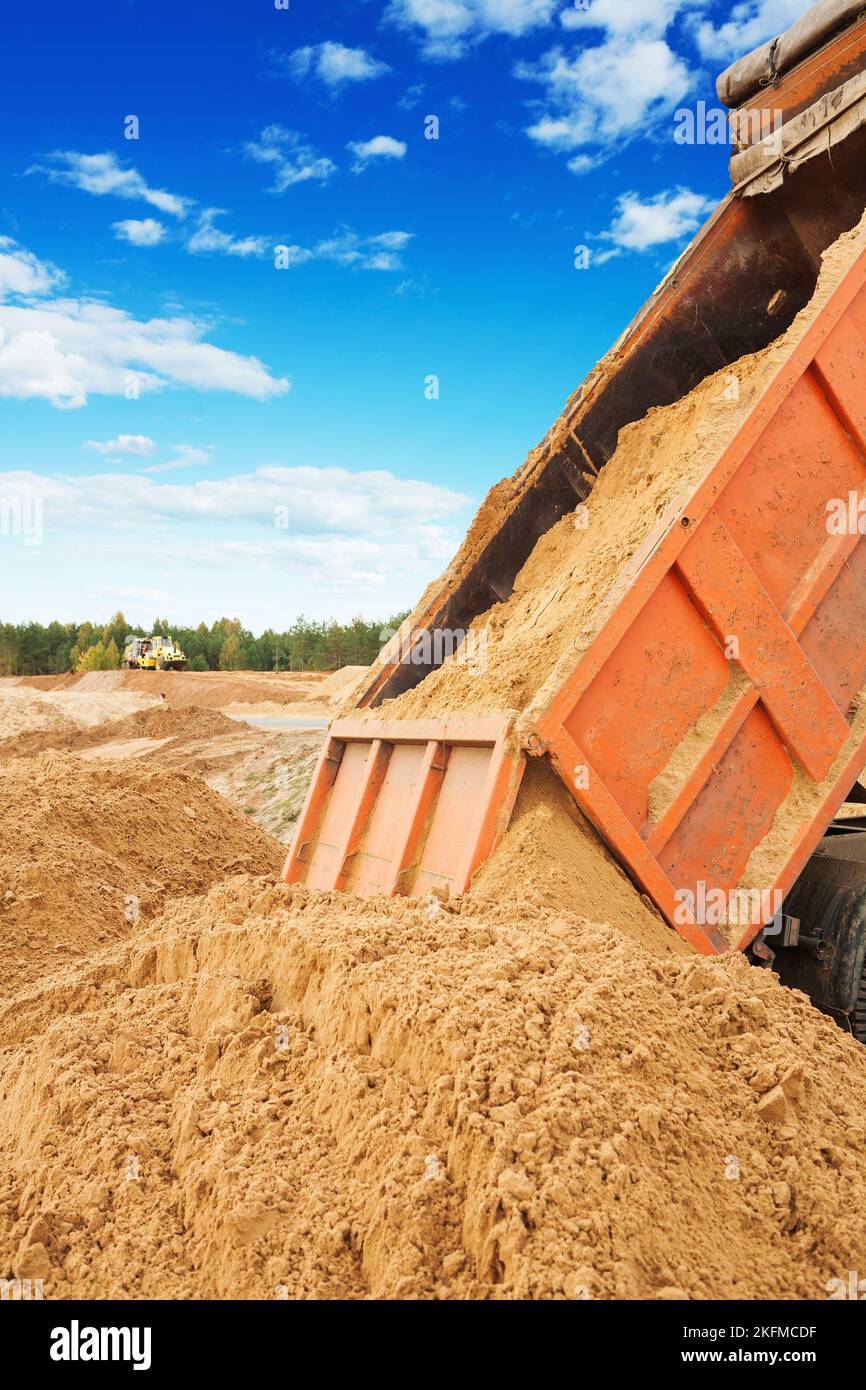road works tipper unloadding sand at construction site Stock Photo - Alamy