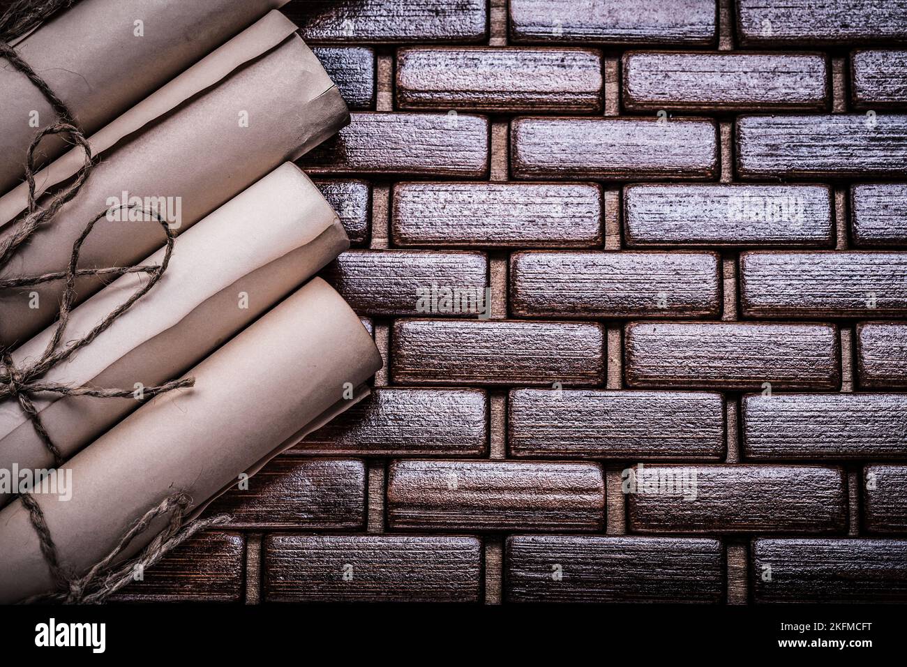 Rolled up ancient documents on wicker wooden matting Stock Photo - Alamy