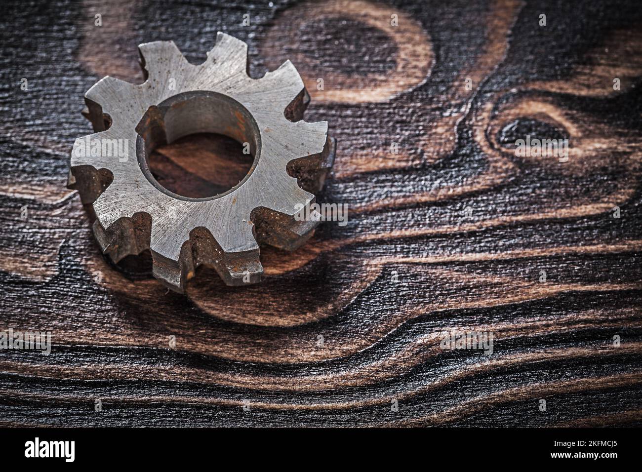 Rough rotary cutter on vintage wood board top view construction concept ...