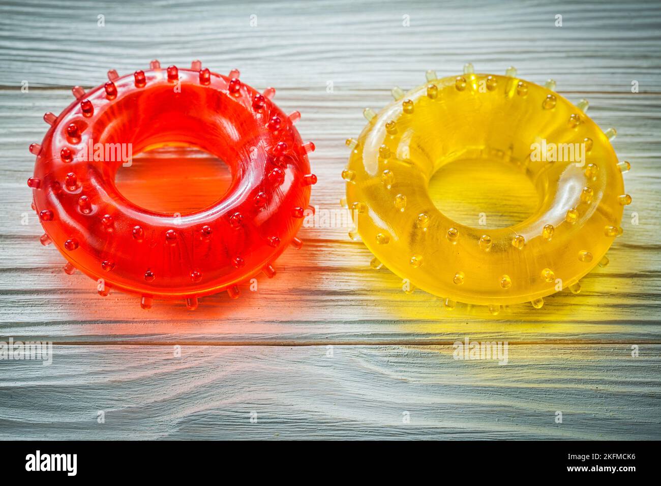 Rubber round hand expanders on wooden board sports training concept ...