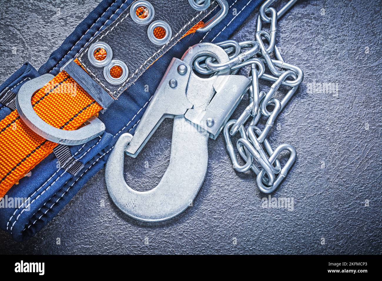 Safety belt with metal chain carabiners on black background top view ...