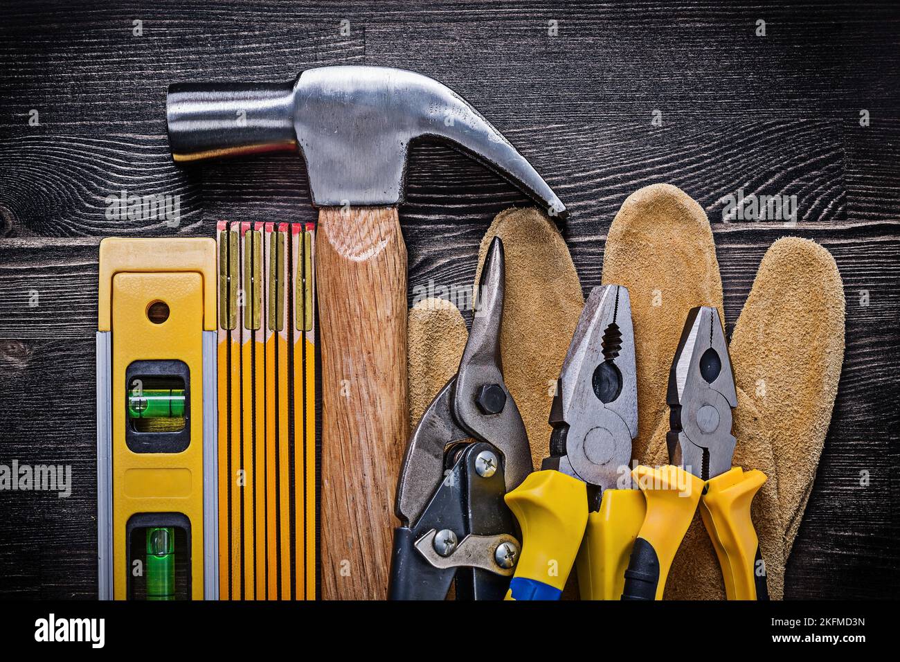 Safety gloves pliers wire cutter wooden meter construction level hammer ...