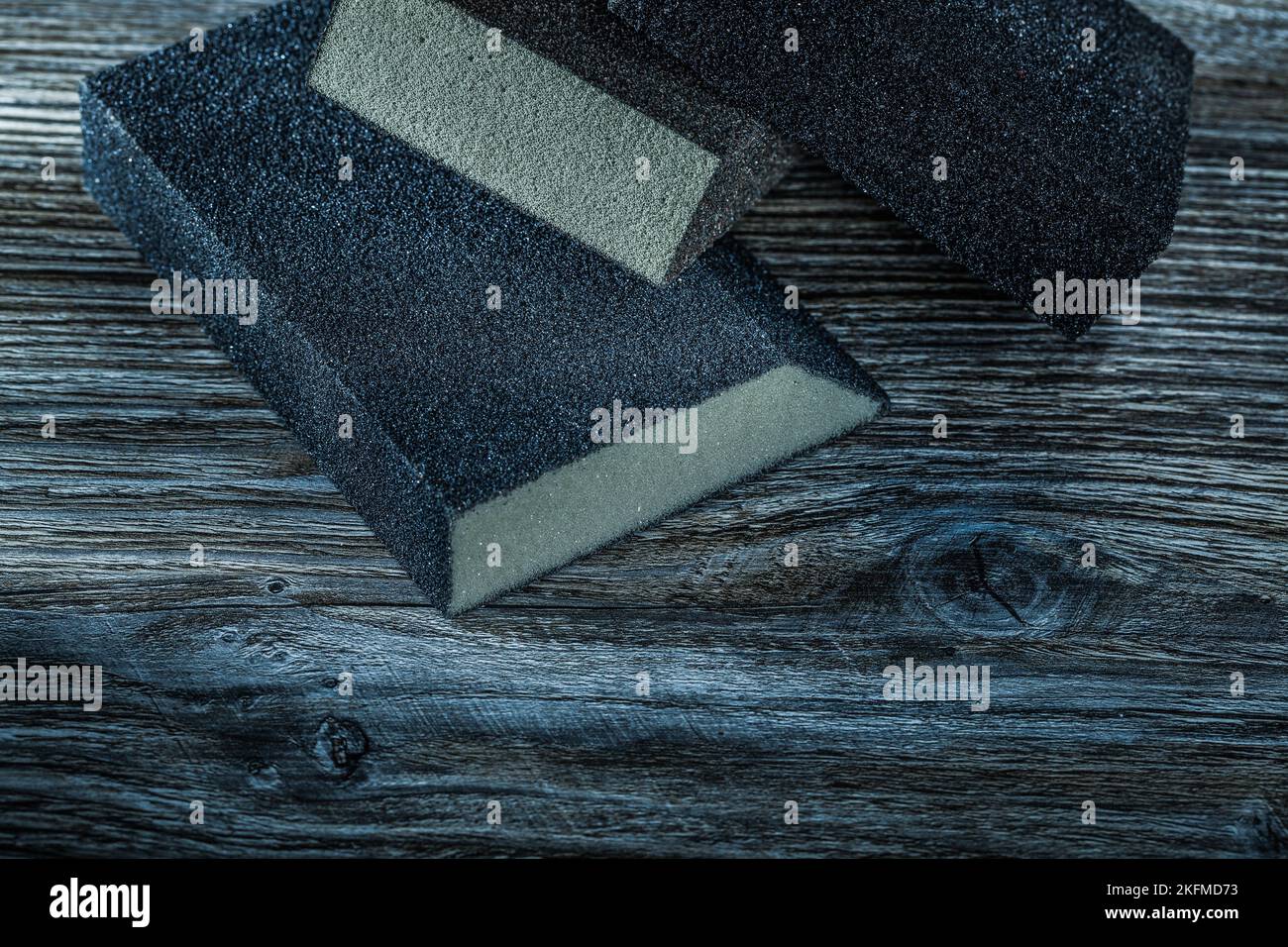 Sanding sponges on vintage wooden board top view Stock Photo - Alamy