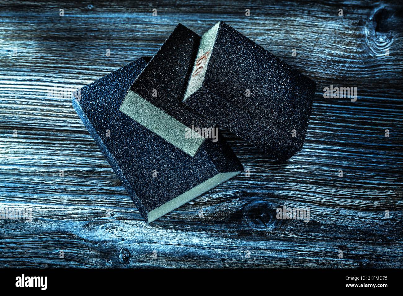 Sanding sponges on vintage wooden board Stock Photo - Alamy