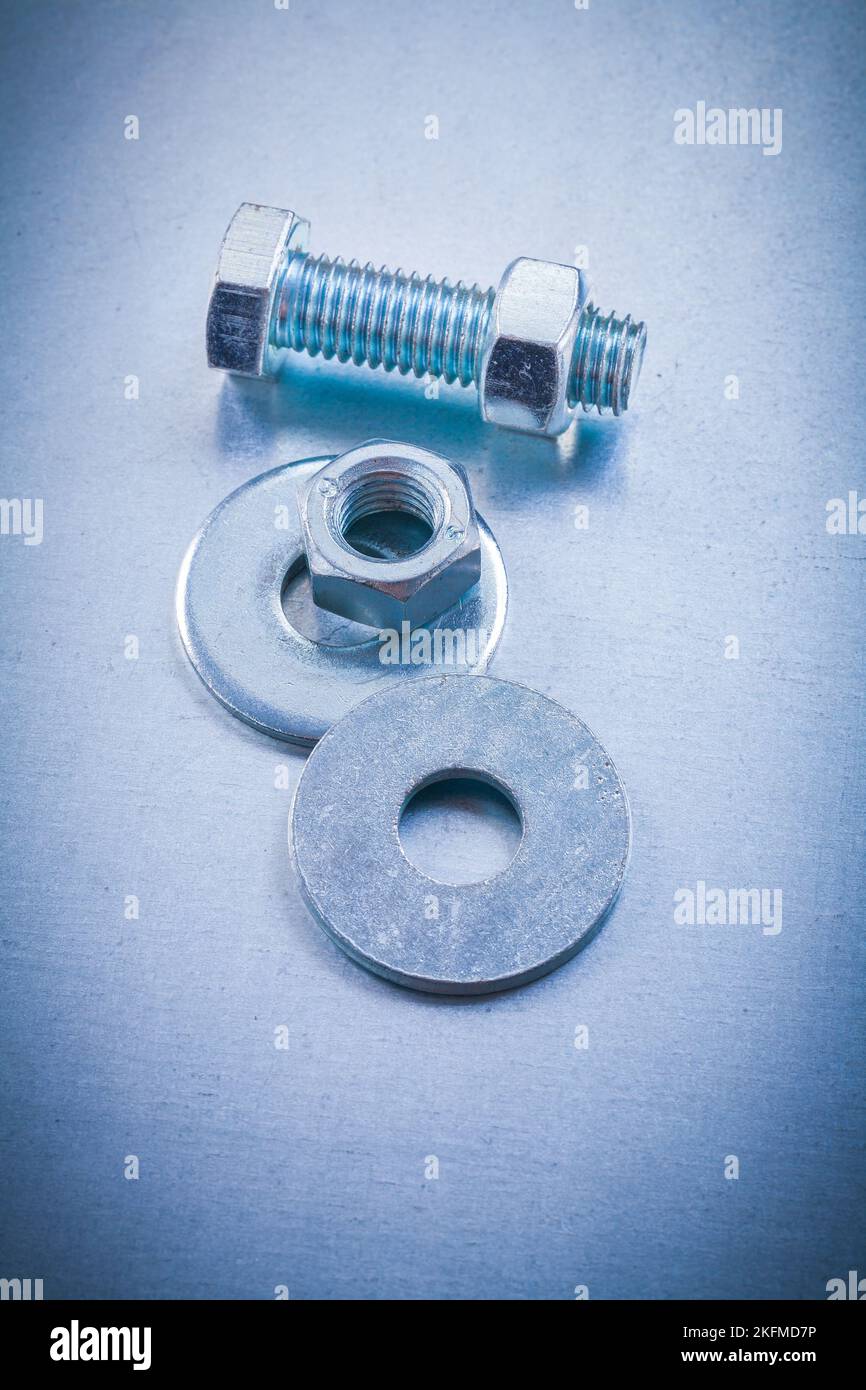 Screwbolt bolt washers and screw nuts on metallic background ...