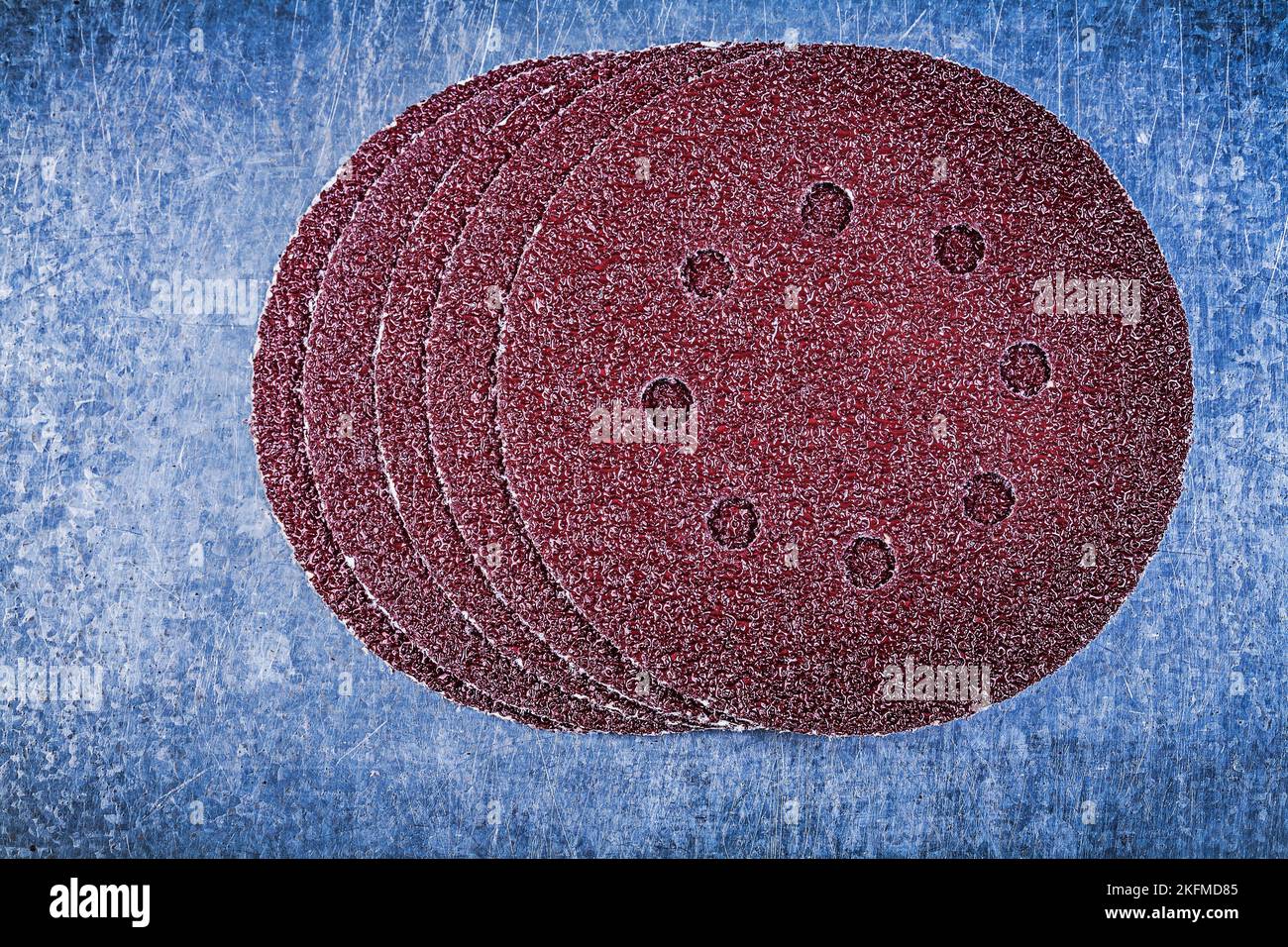 Sanding wheels on scratched metallic background abrasive materials ...