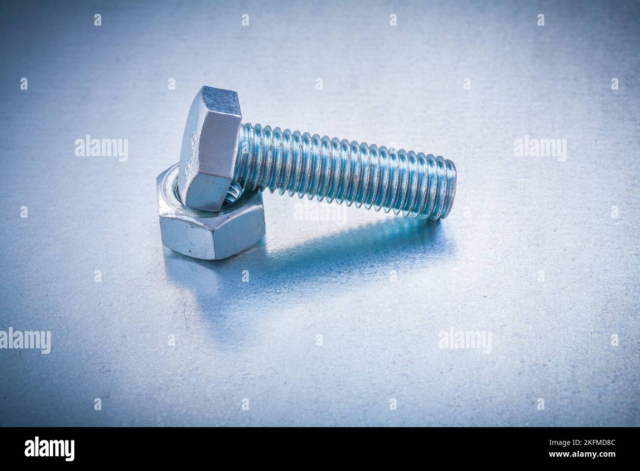Screwbolt and screw nut on metallic background construction concept ...