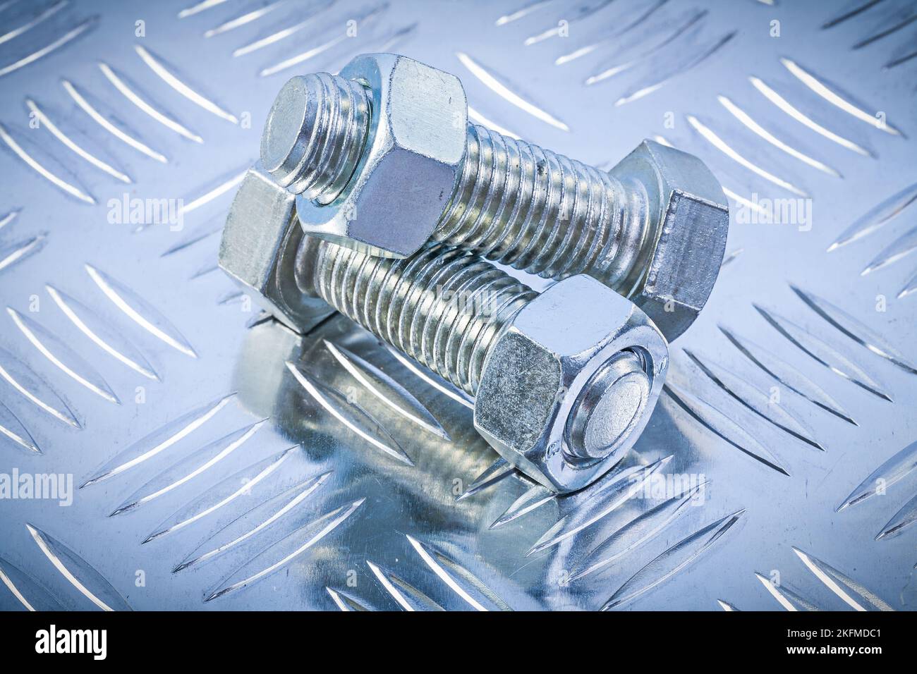 Screwbolts and construction nuts on fluted metal plate maintenance ...