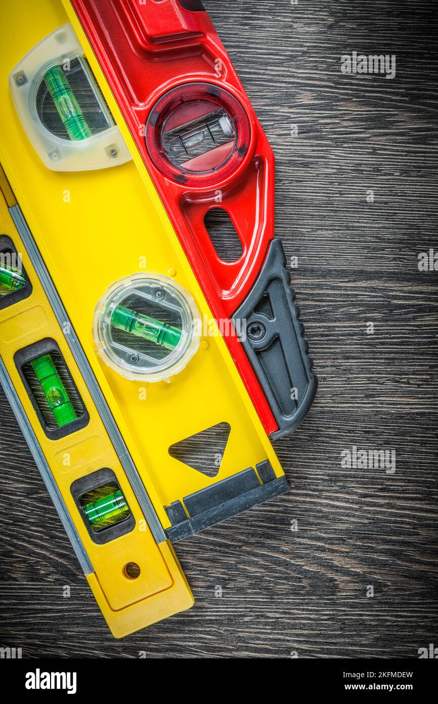 Set of construction levels on wooden board Stock Photo - Alamy
