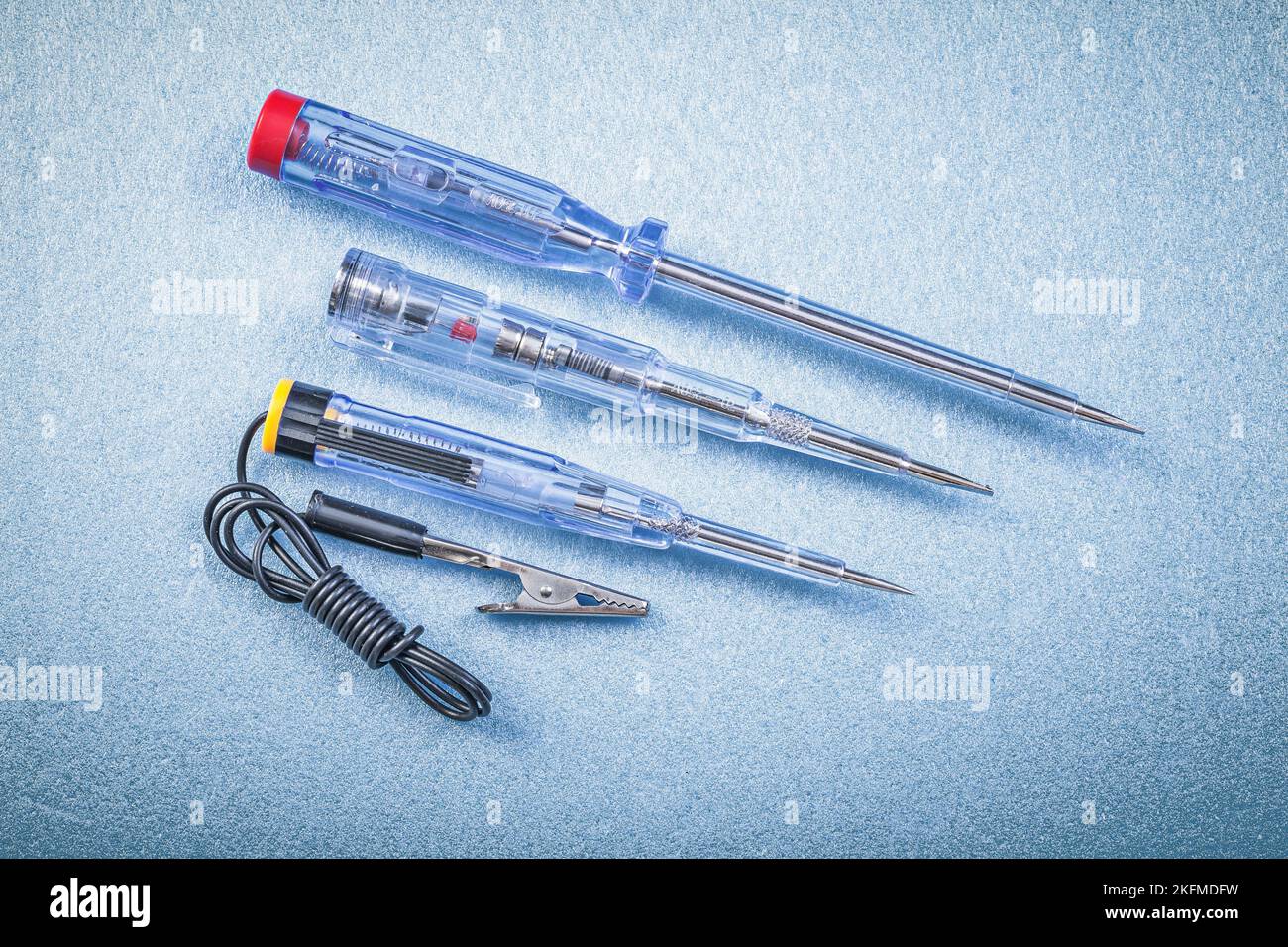 Set of electric testers on blue background electricity concept Stock ...