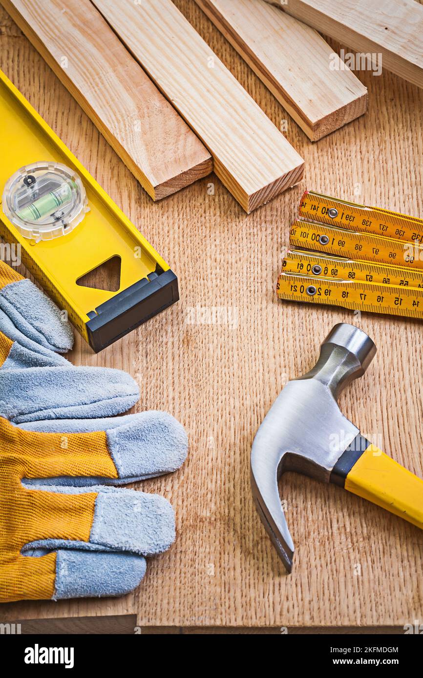 set of carpentry tools claw hammer protective gloves wooden meter ...