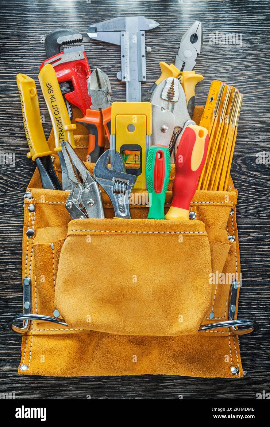 Set of leather tool belt building tooling vertical view Stock Photo - Alamy