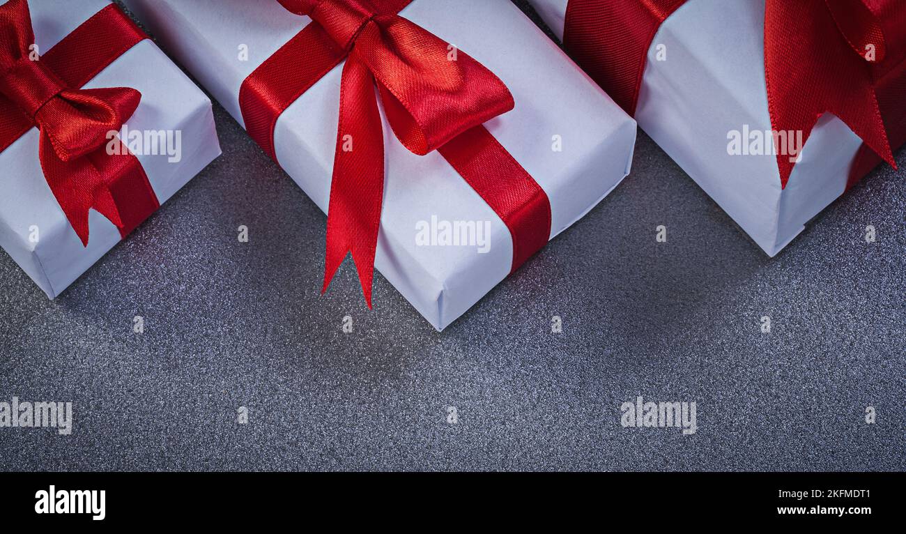 Set of present boxes on grey surface holidays concept Stock Photo - Alamy