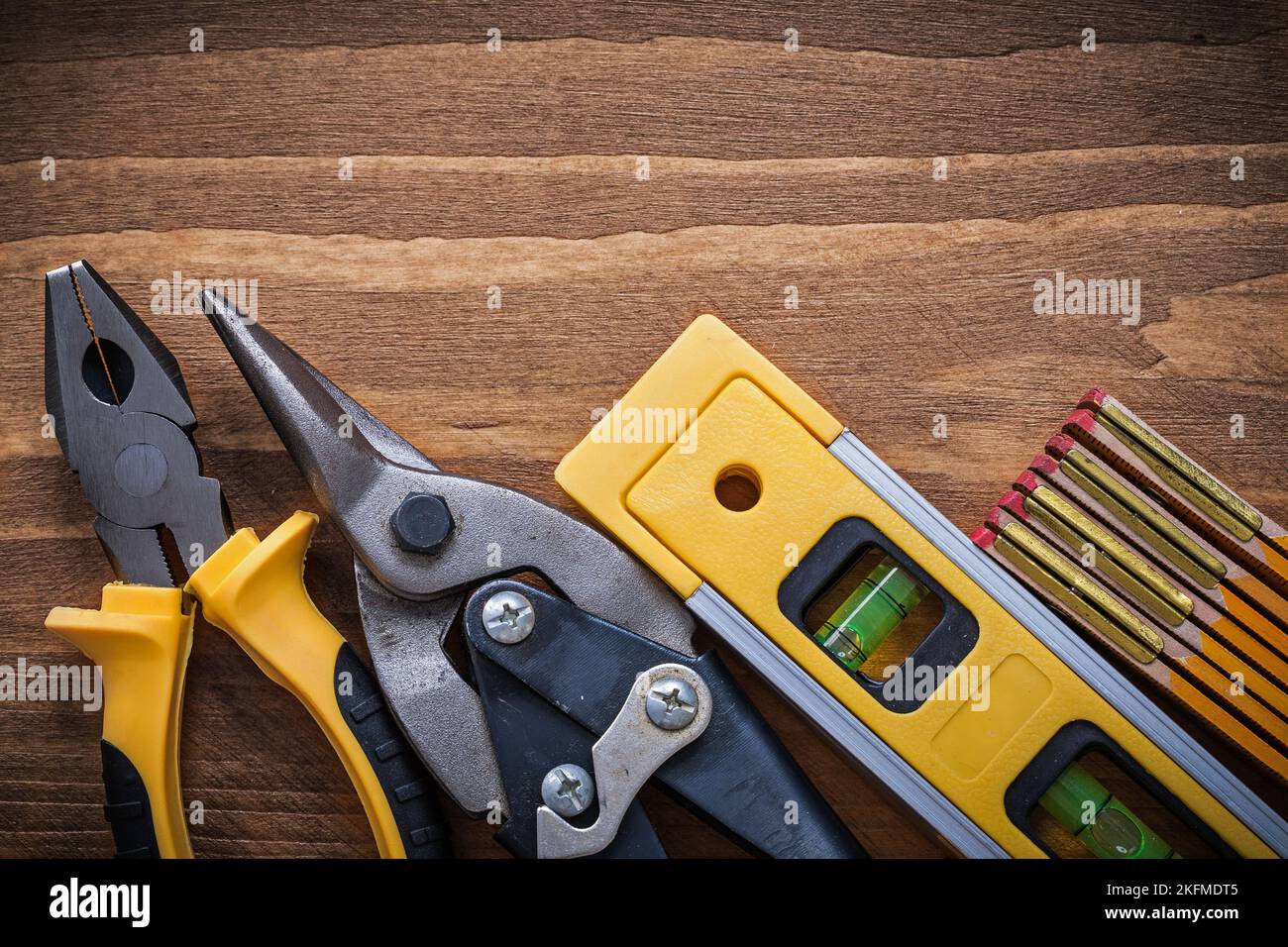 Set of pliers sharp steel cutter construction level wooden meter Stock ...