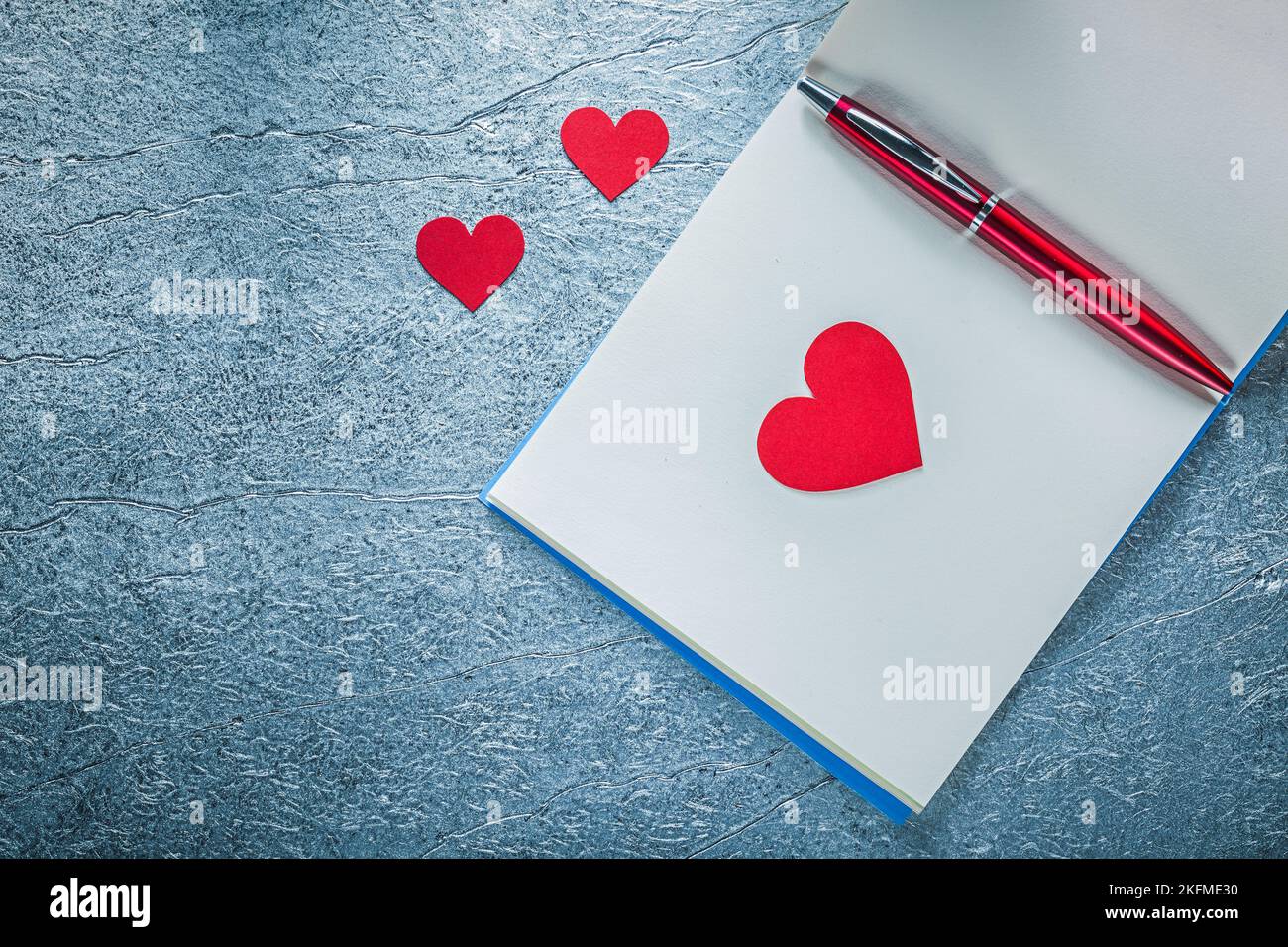Set of red hearts biro pen clean notepad on metallic background ...
