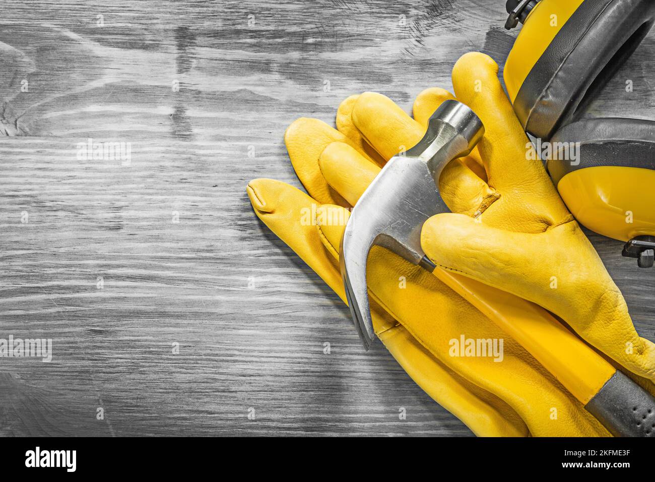 Set of safety workwear claw hammer on wooden board construction concept ...