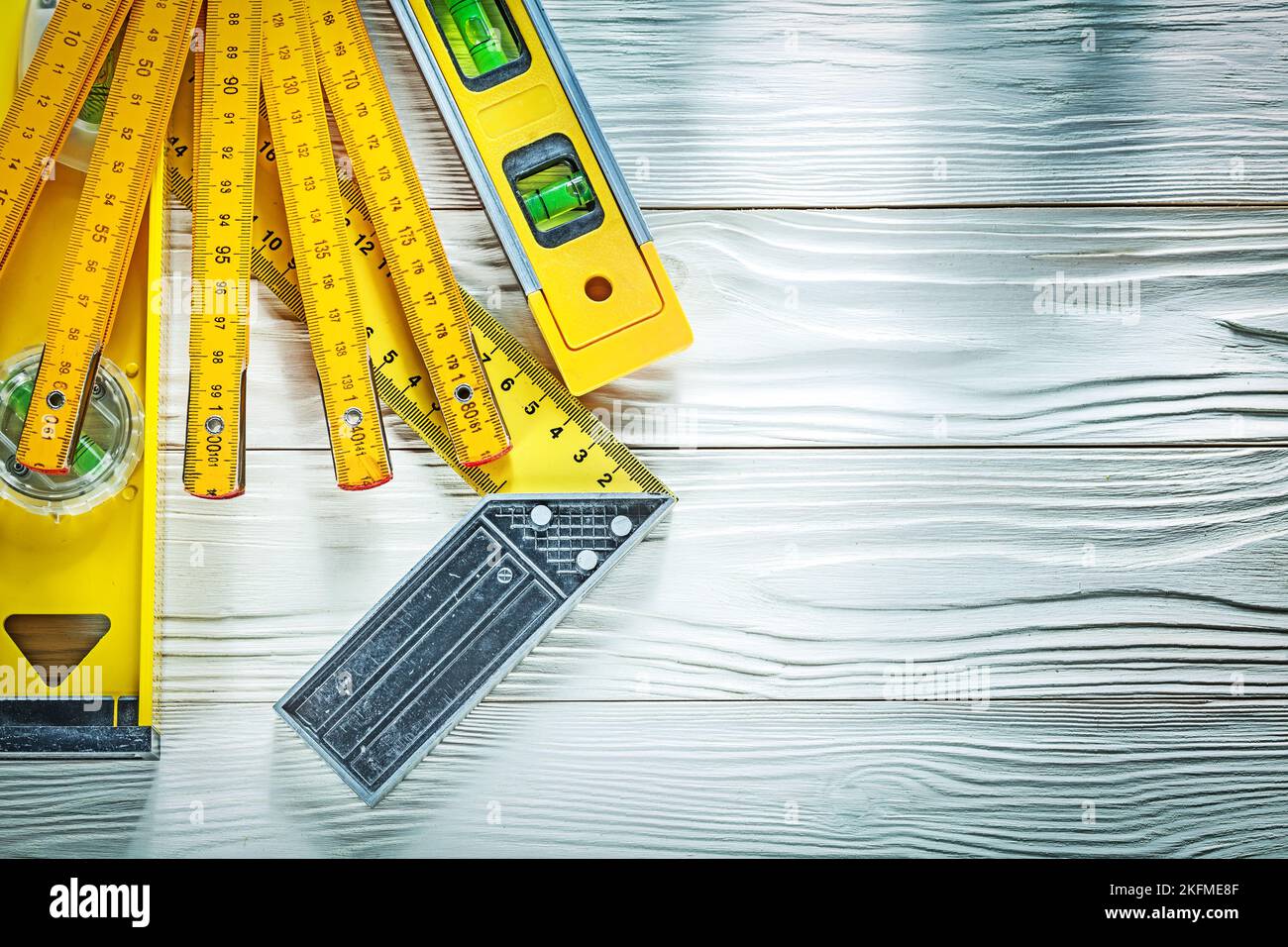 Set of wooden meter construction level try square on white board Stock ...