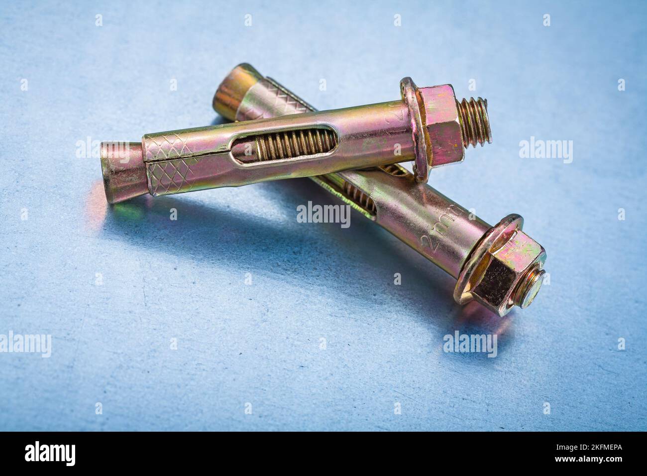 Some anchor bolts for concrete walls on metallic background ...