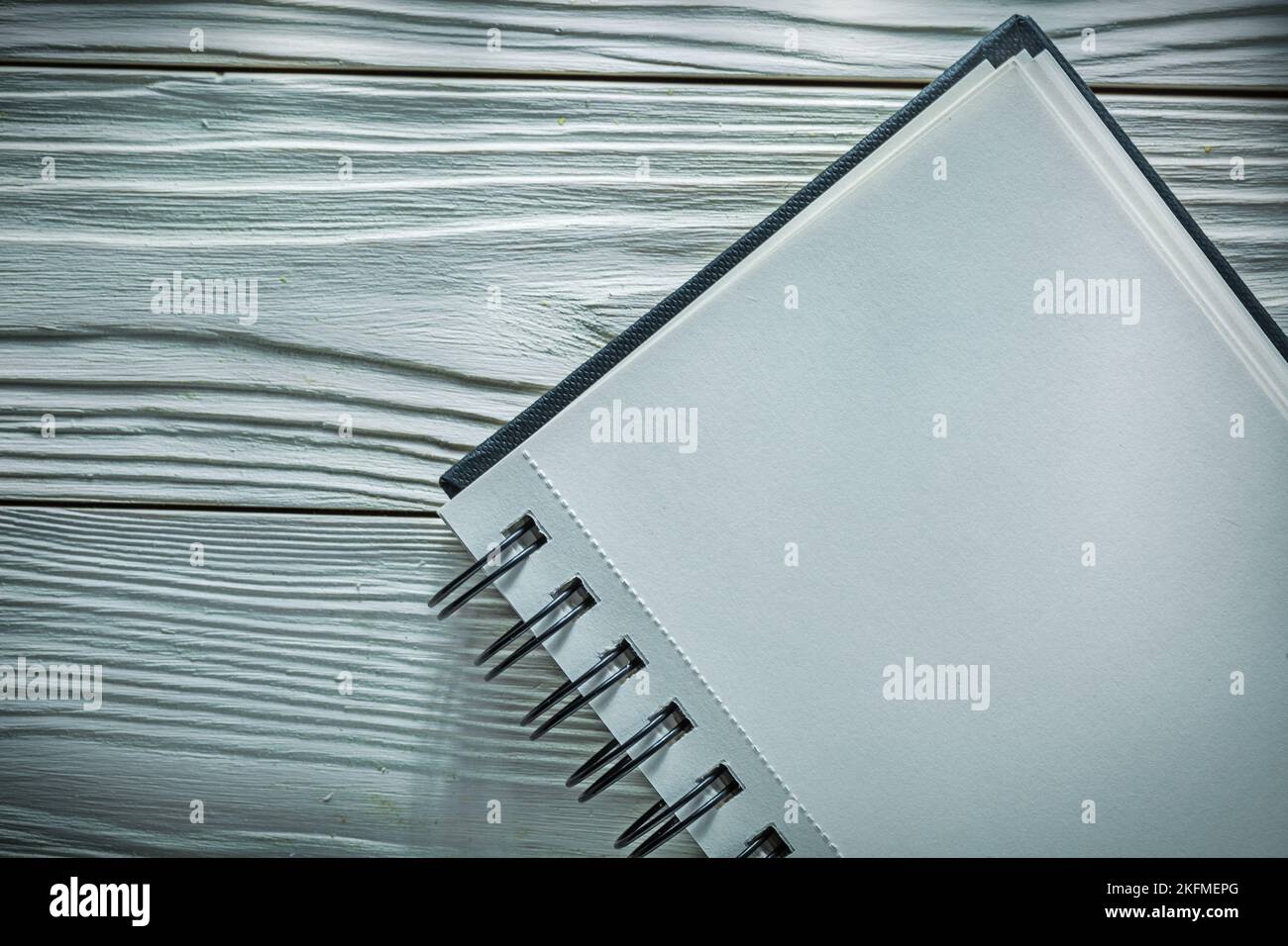 Spiral blank notepad on white wooden board Stock Photo - Alamy