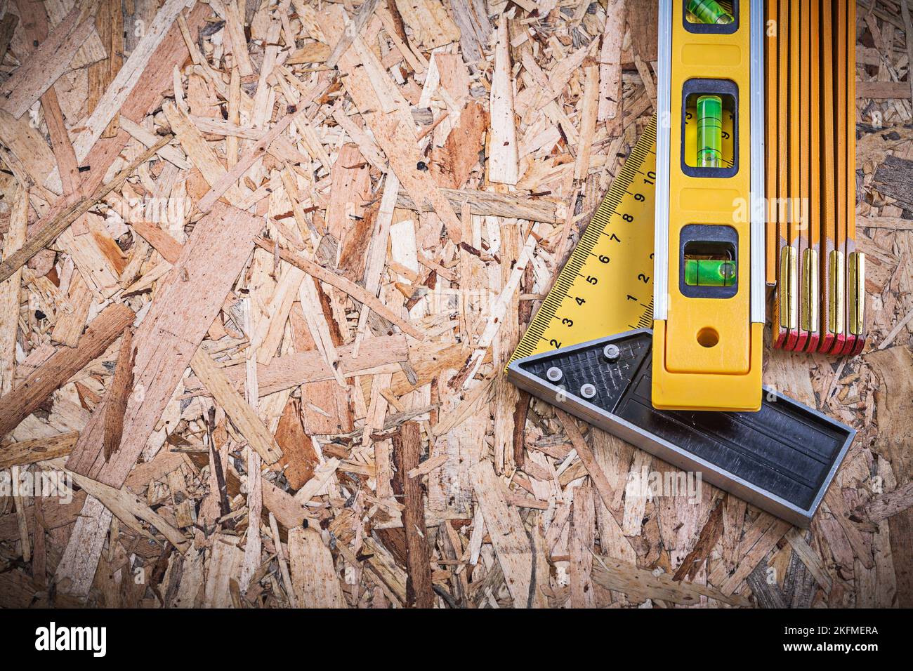 Square ruler construction level wooden meter on OSB Stock Photo - Alamy