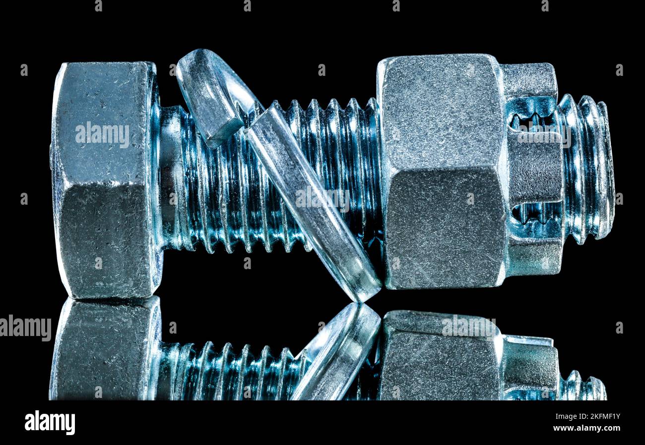 Stainless construction nut screwbolt spring washer on black surface ...