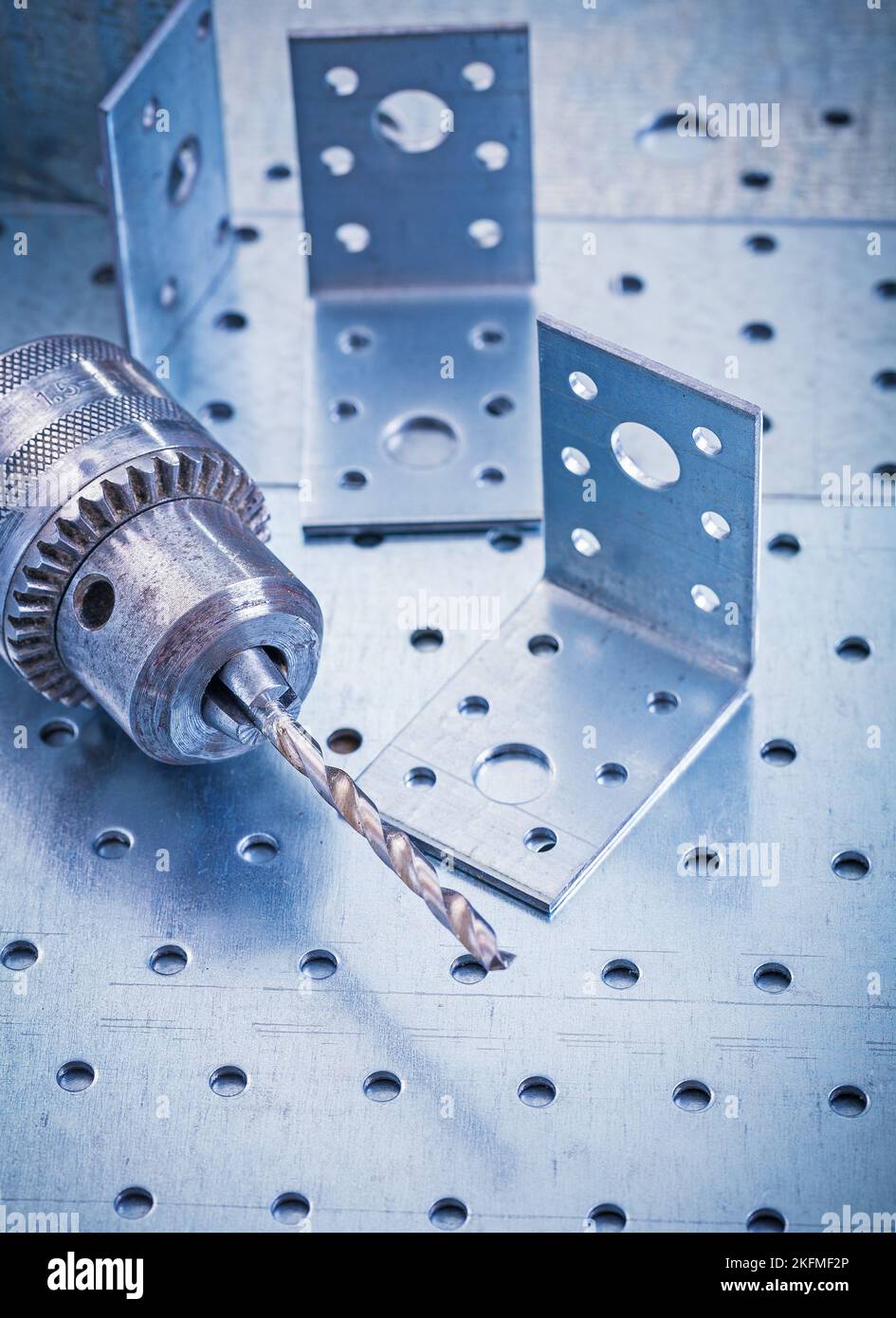 Stainless drilled angle fasteners and metal drill on perforated ...