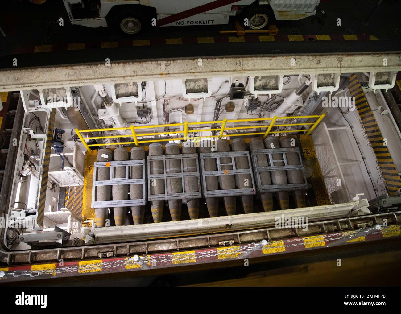 Ammunition is lowered down to the magazine by the ship's advanced ...