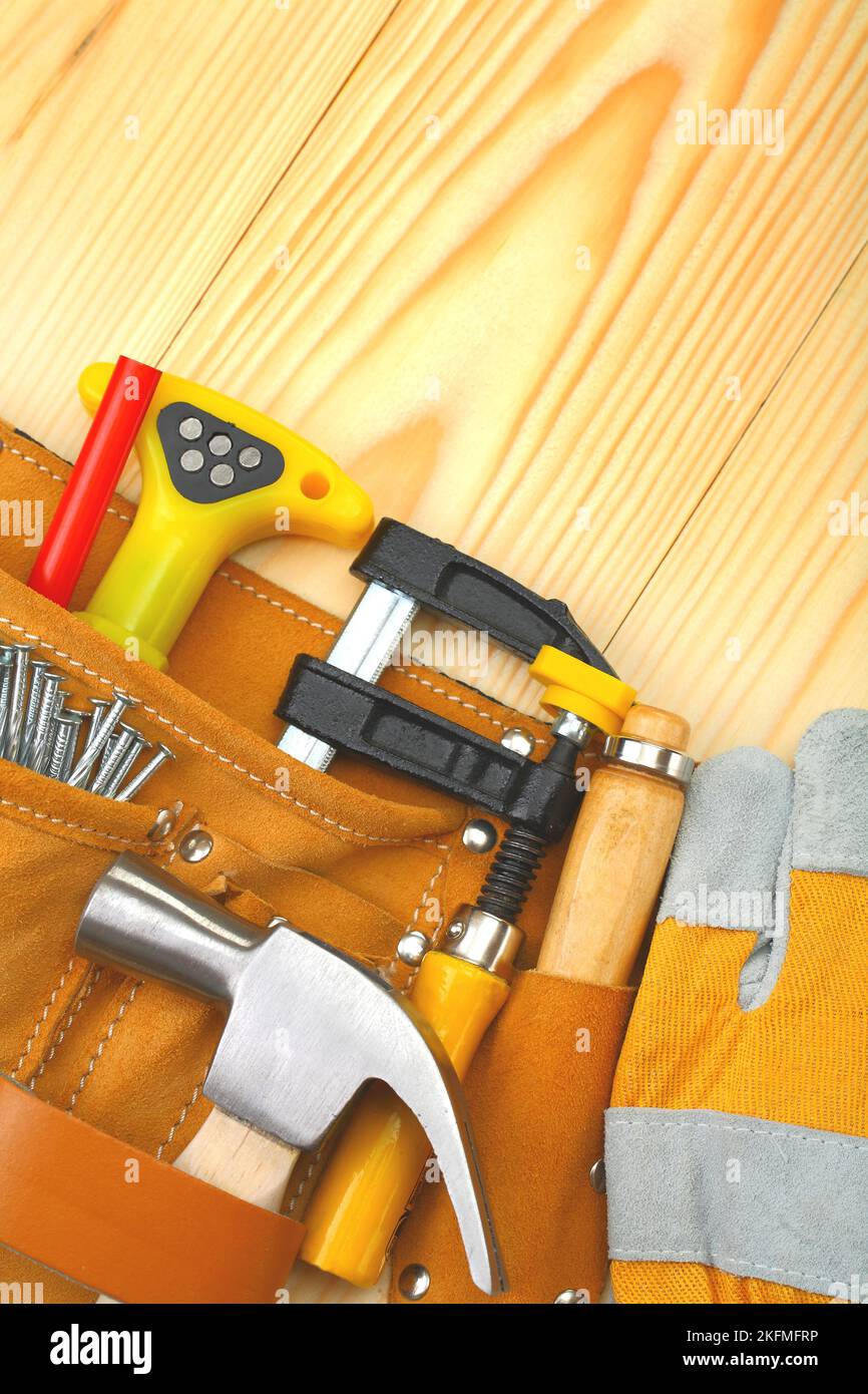 tools in belt on wooden boards Stock Photo - Alamy