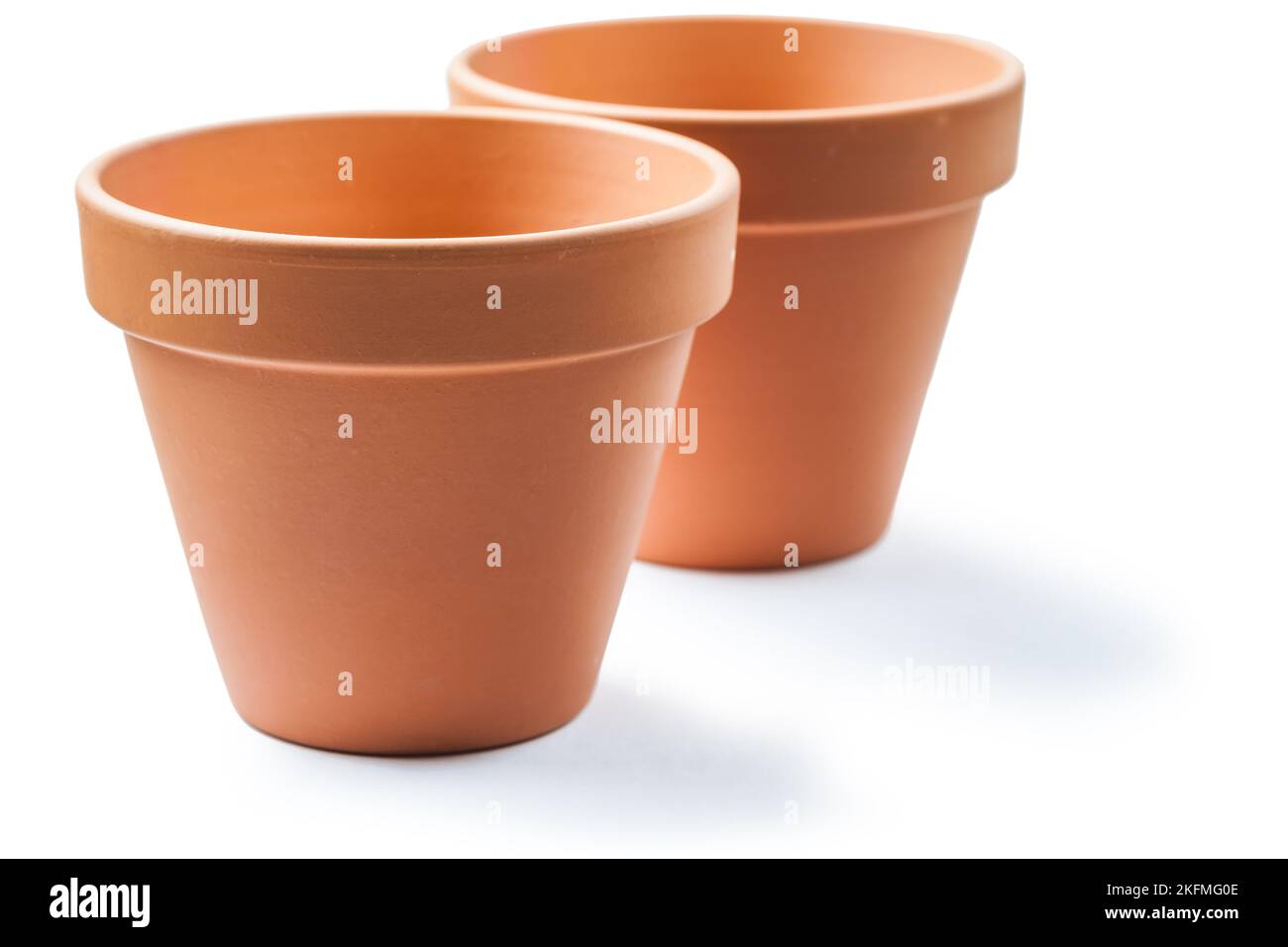 two clay brown pots isolated on white Stock Photo - Alamy