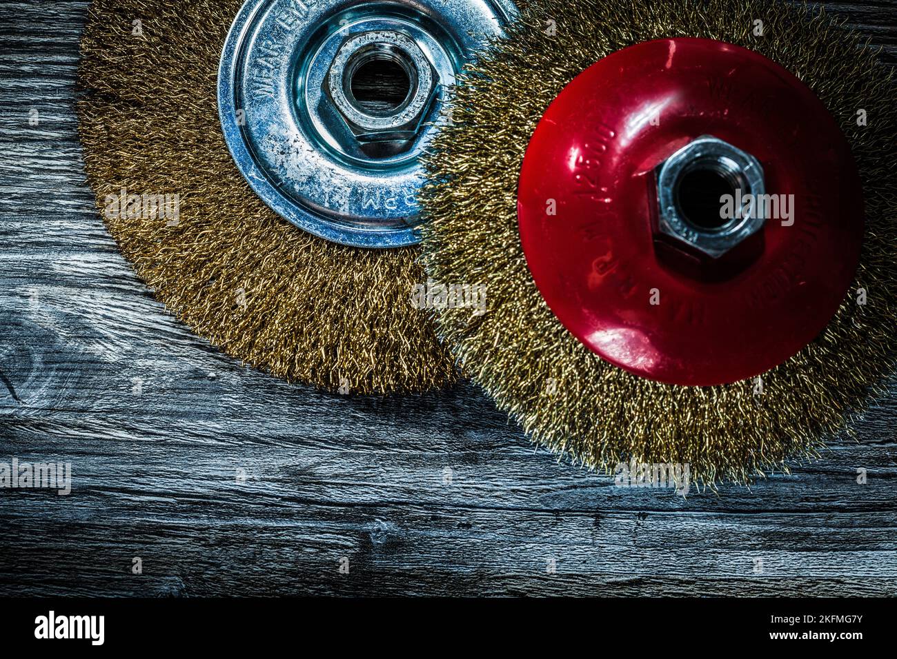 Used brass round brushes on vintage wooden board Stock Photo - Alamy