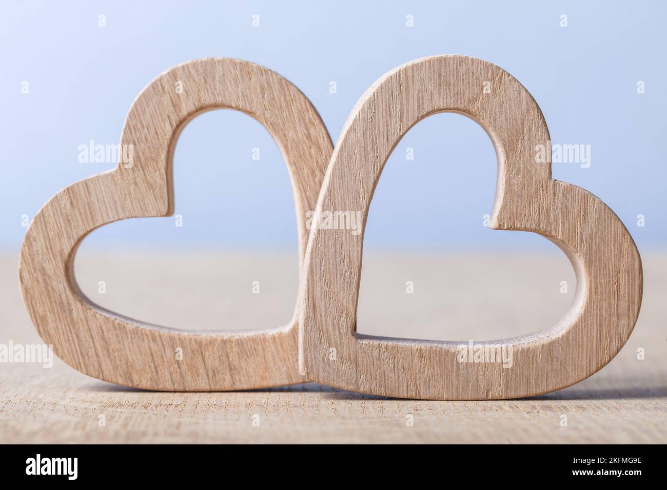 two wood hearts simbol of love Stock Photo - Alamy
