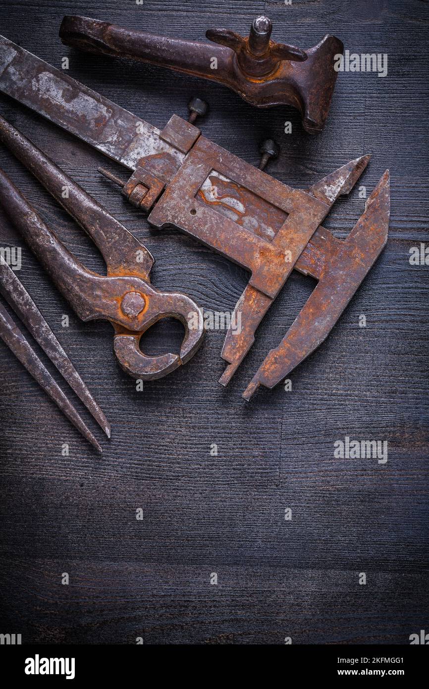 vertical view vintage rusted tools on old board Stock Photo - Alamy