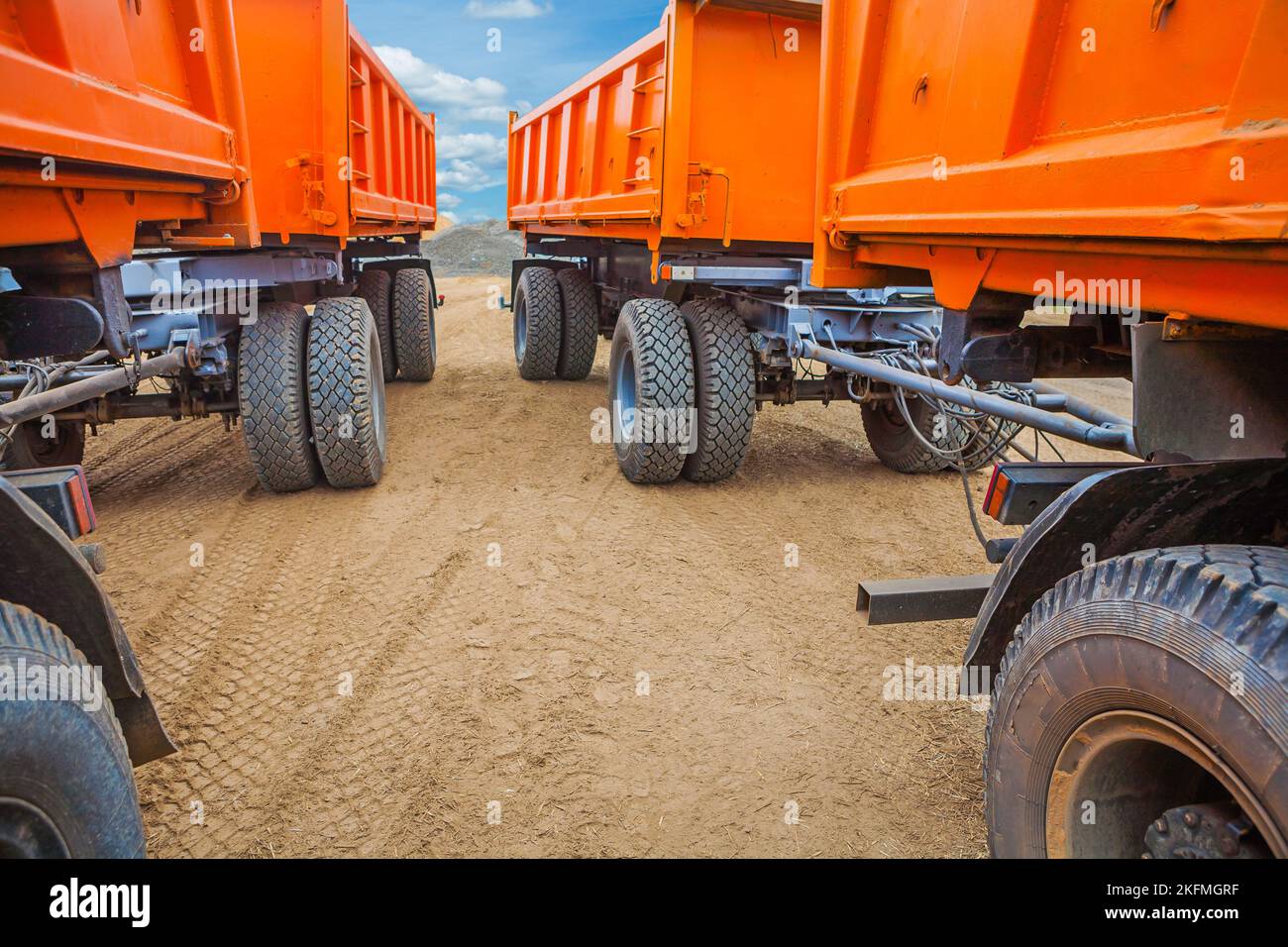 view through two rows of tippers Stock Photo - Alamy