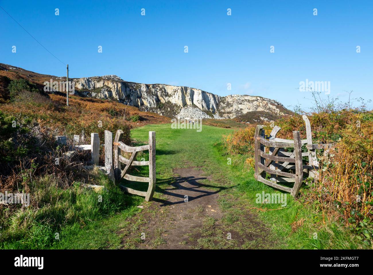 Dramatic rock face of old quarry at Breawater Country Park, Holyhead ...