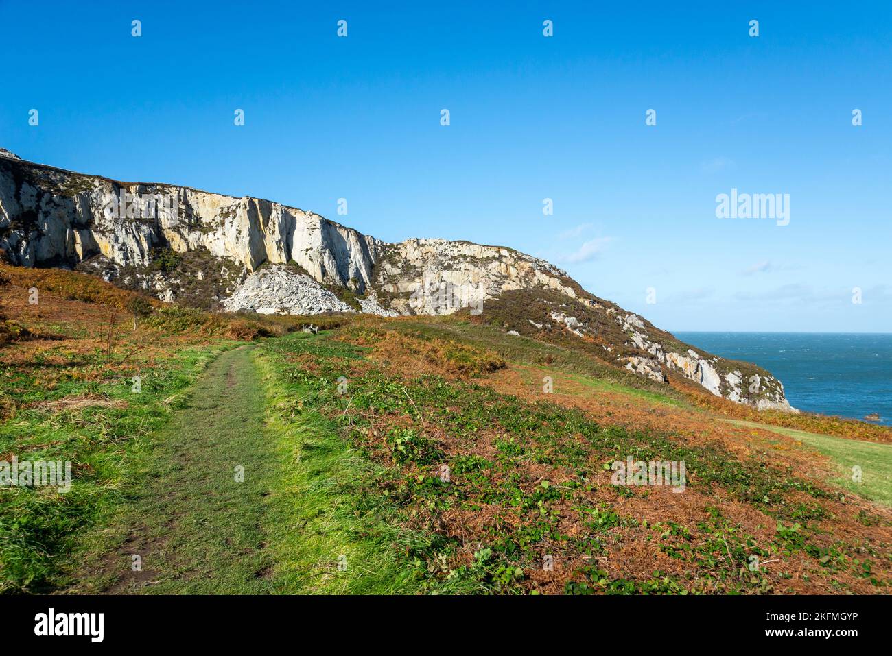 Dramatic rock face of old quarry at Breawater Country Park, Holyhead ...