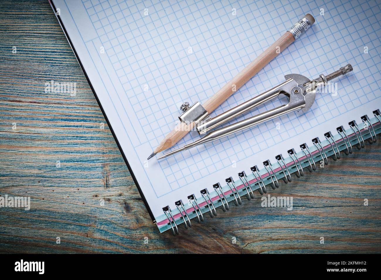 Vintage divider pencil checked copybook on wooden board construction ...