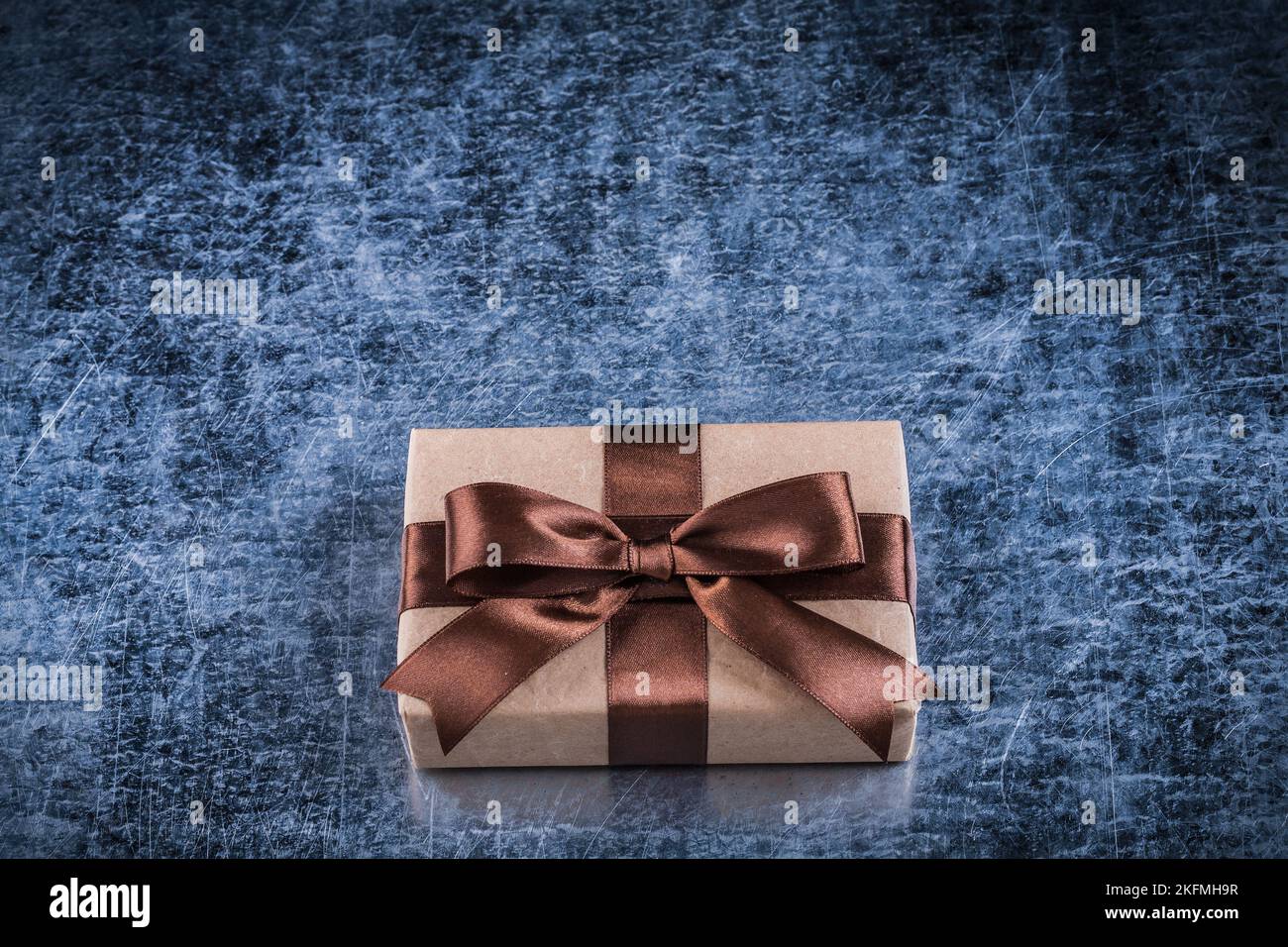 Vintage present box on scratched metallic background holidays concept ...