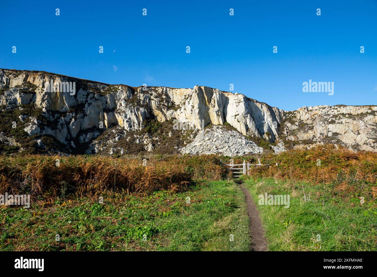 Dramatic rock face of old quarry at Breakwater Country Park, Holyhead ...