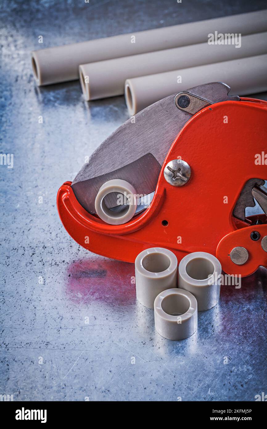 Water pipe cutter on metallic background vertical version construction ...