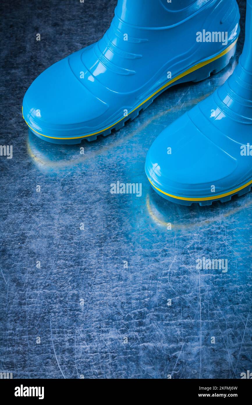 Waterproof garden gum boots on scratched metallic surface Stock Photo ...