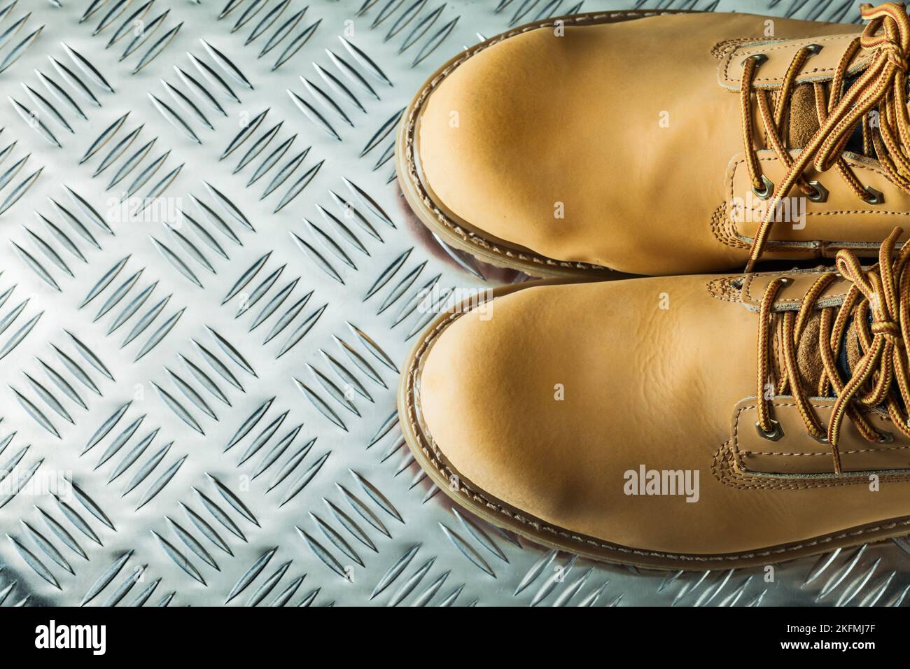 Waterproof boots on corrugated metal sheet Stock Photo - Alamy
