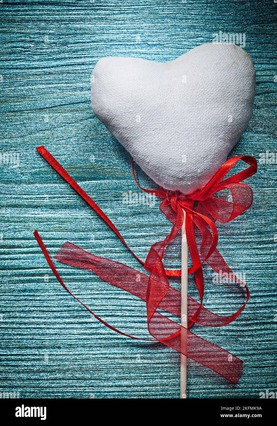 White heart with red ribbons on wooden board holidays concept Stock ...