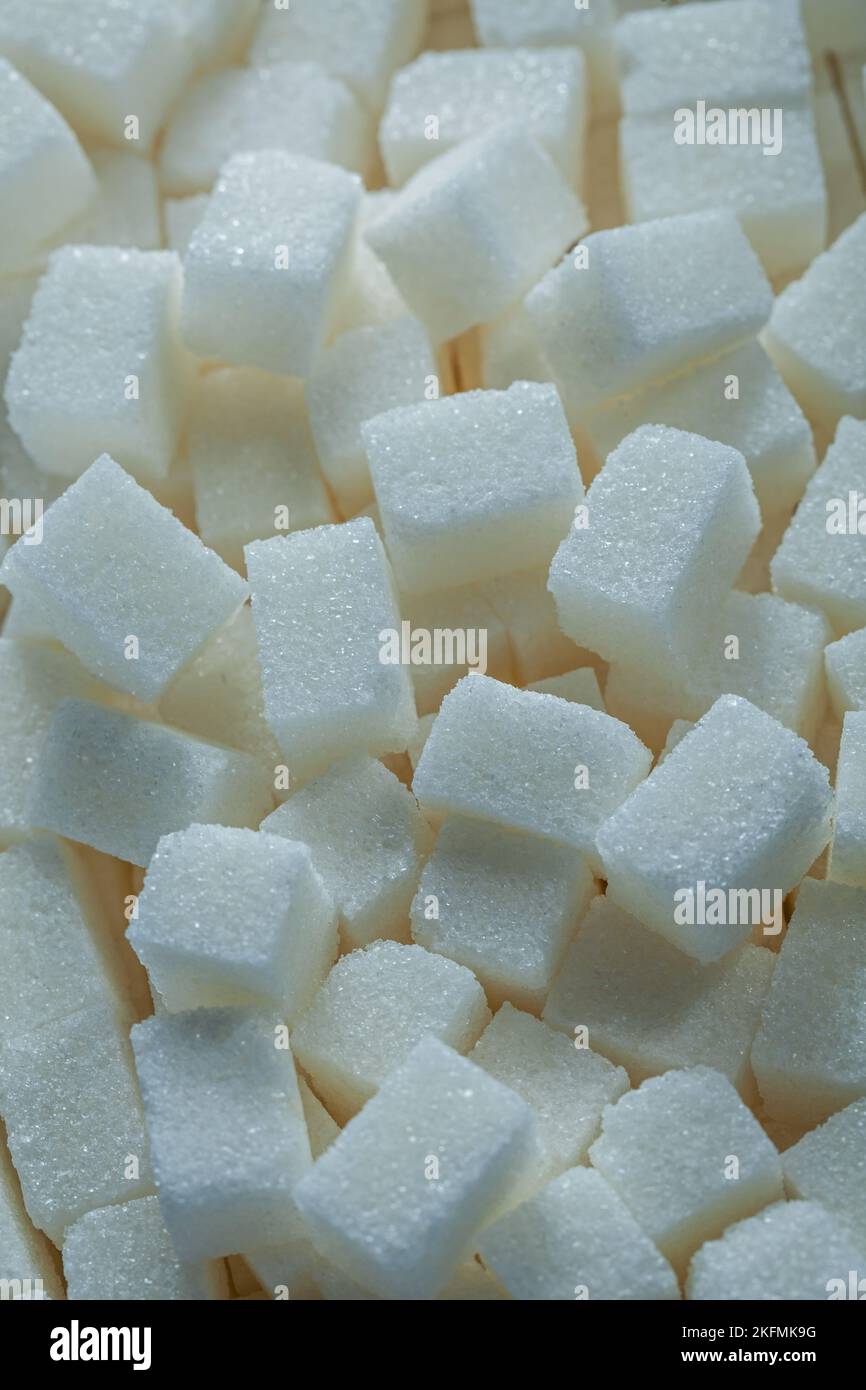 White sugar cubes food concept vertical view Stock Photo - Alamy