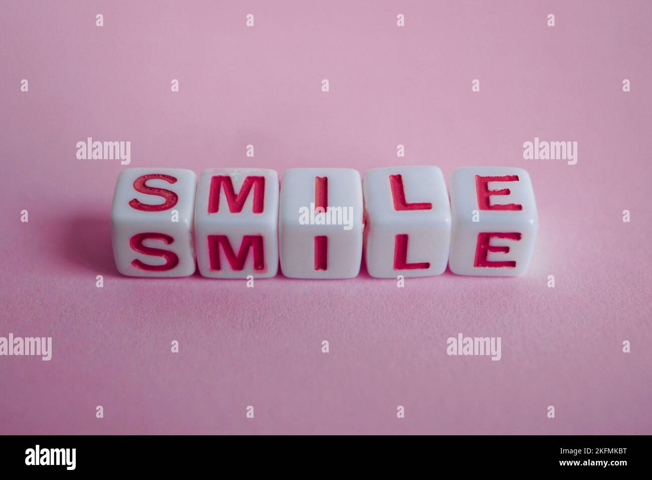 smile word on the pink background, feelings and emotions Stock Photo ...