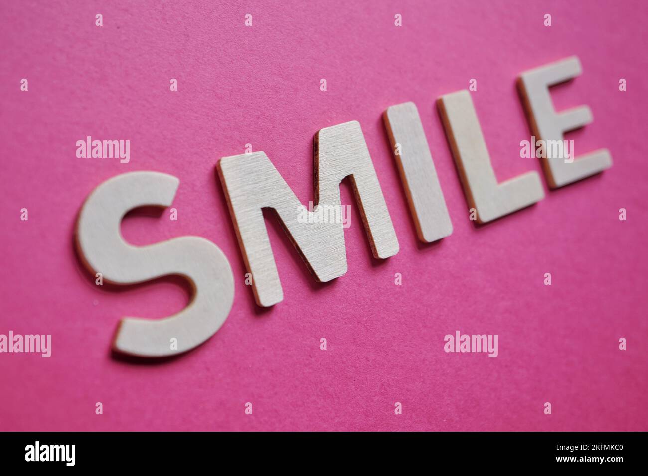 smile word on the pink background, feelings and emotions Stock Photo ...