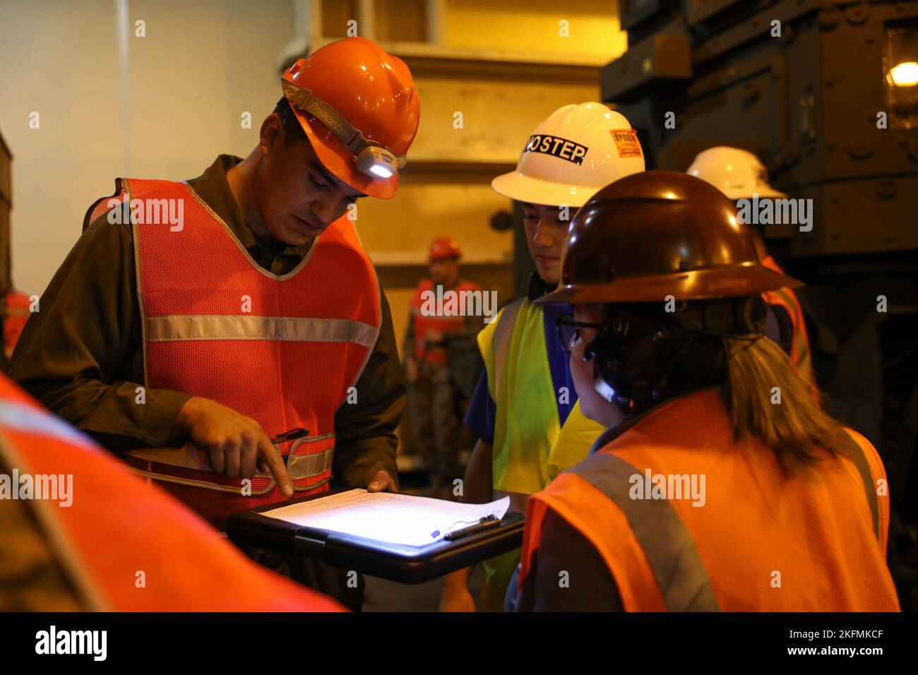 U.S. Marine Corps Sgt. Lucas Francis, left, a motor transport mechanic ...